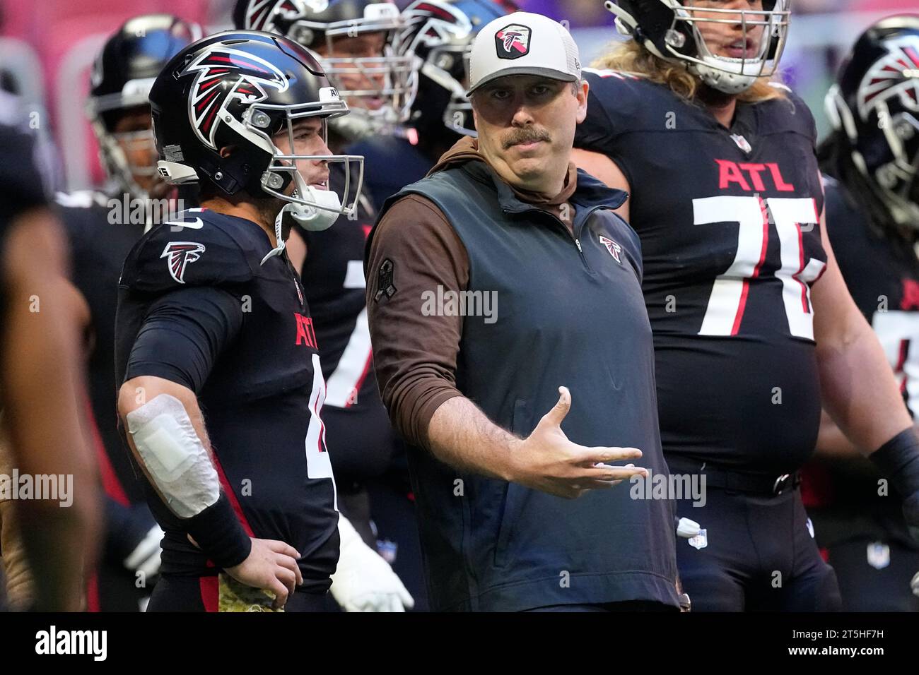 Atlanta Falcons head coach Arthur Smith, right, speaks to quarterback ...