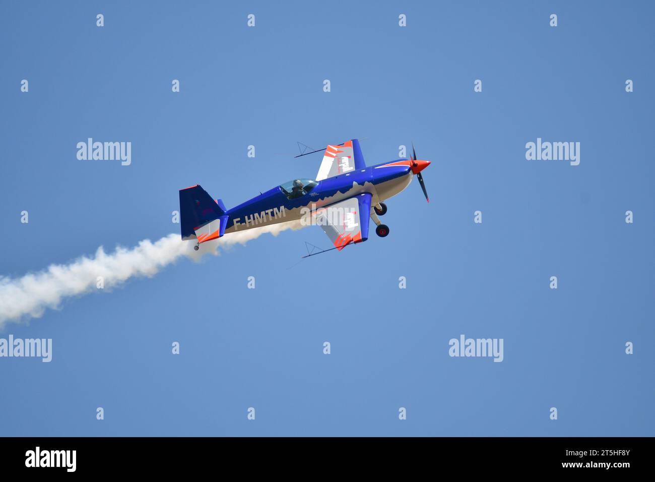 Skopje, Macedonia. The French acrobatic plane Extra 330SC with a trail ...