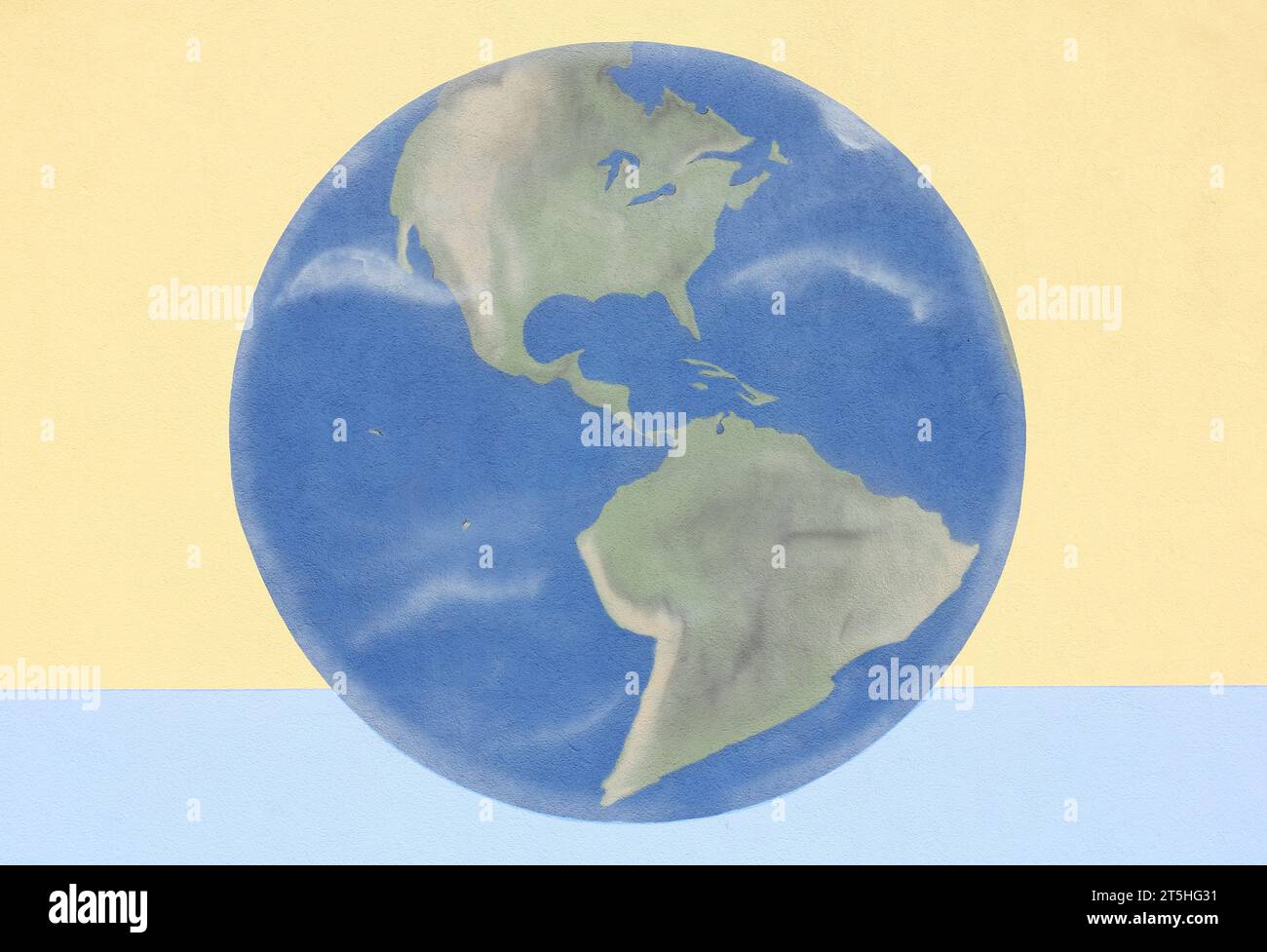 The round earth globe, on a yellow-blue background Stock Photo - Alamy