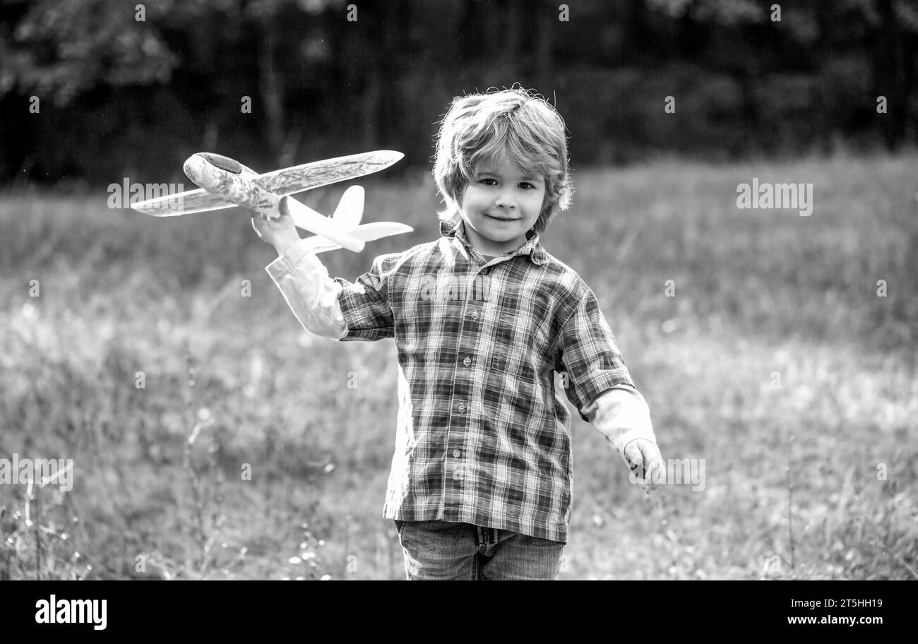 Little boy with plane. Little kid dreams of being a pilot. Happy child ...