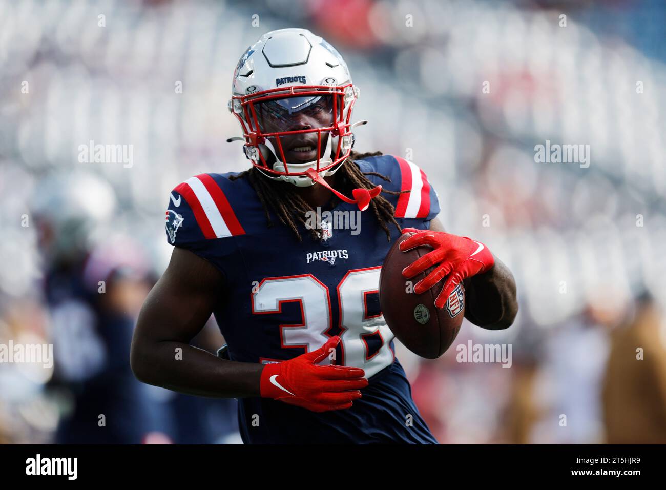 New England Patriots running back Rhamondre Stevenson (38) warms up ...