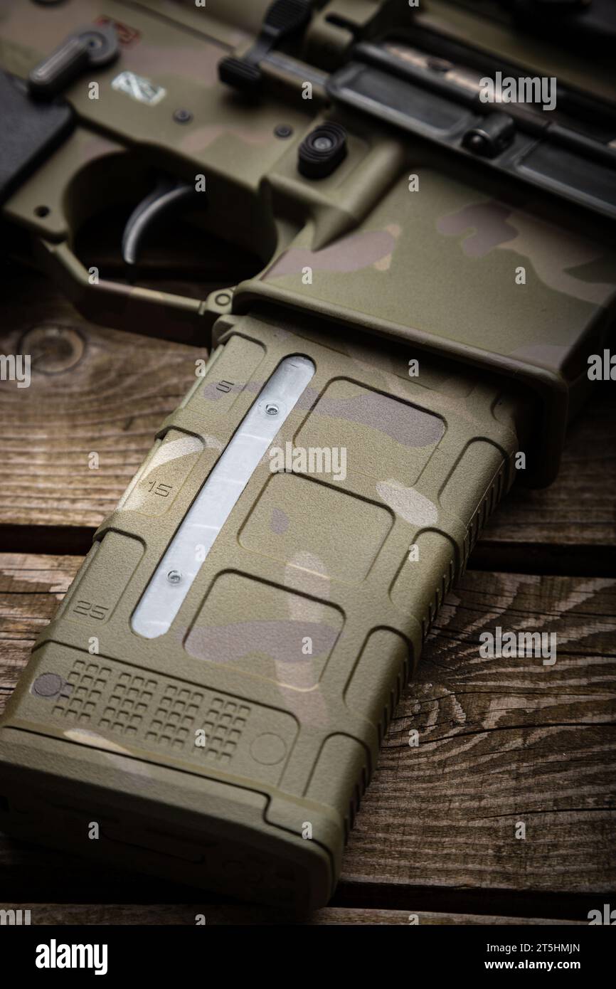 A modern carbine with an optical sight and a silencer. Weapons in ...