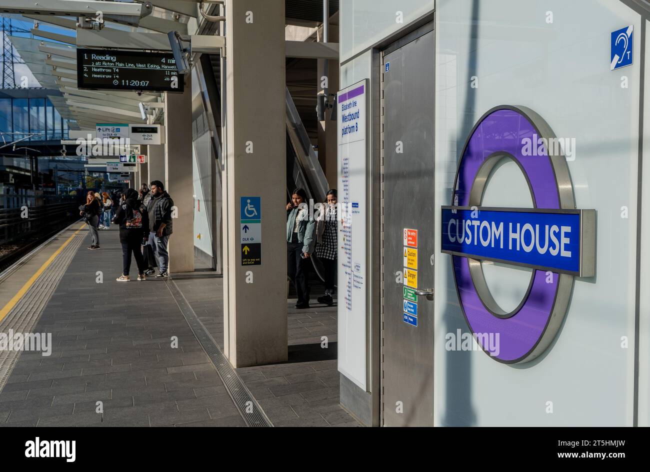 Passengers on the platform of Custom House train station on the ...