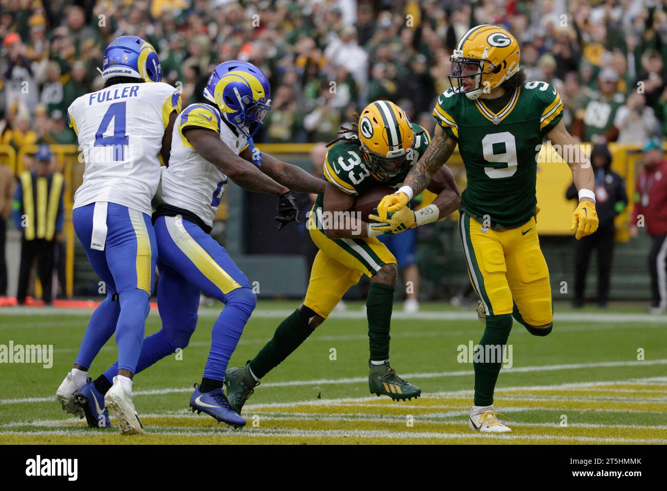 Green Bay Packers running back Aaron Jones (33) scores a 3-yard rushing ...