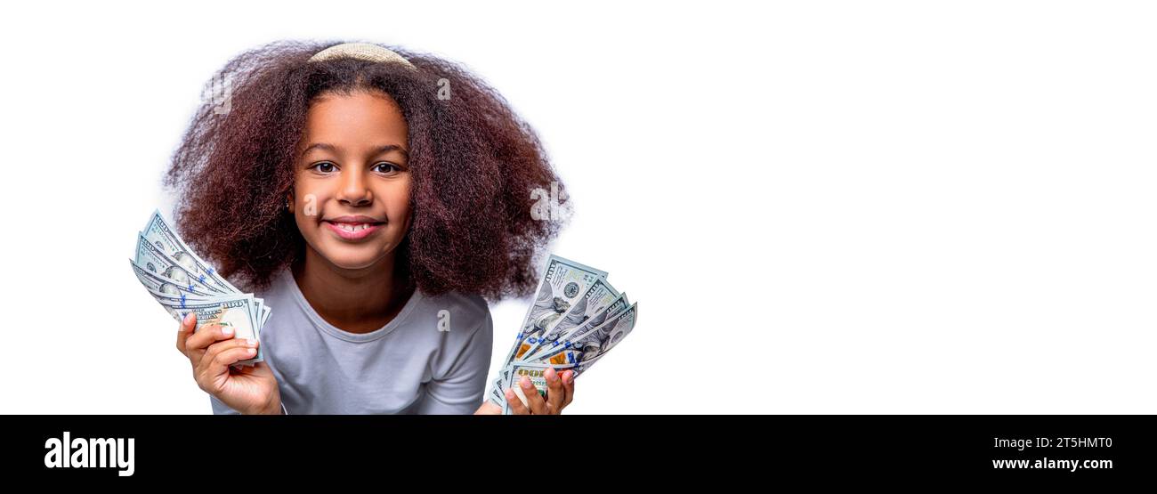 Smiling teenage kid girl holding hundreds of dollar money banknotes ...