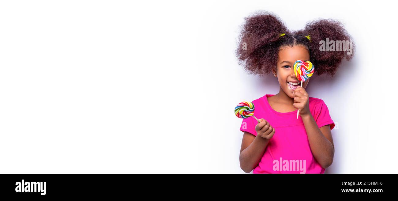 Cute small girl smiling lollipop in hand. Girl afro, lollipops. Smile ...