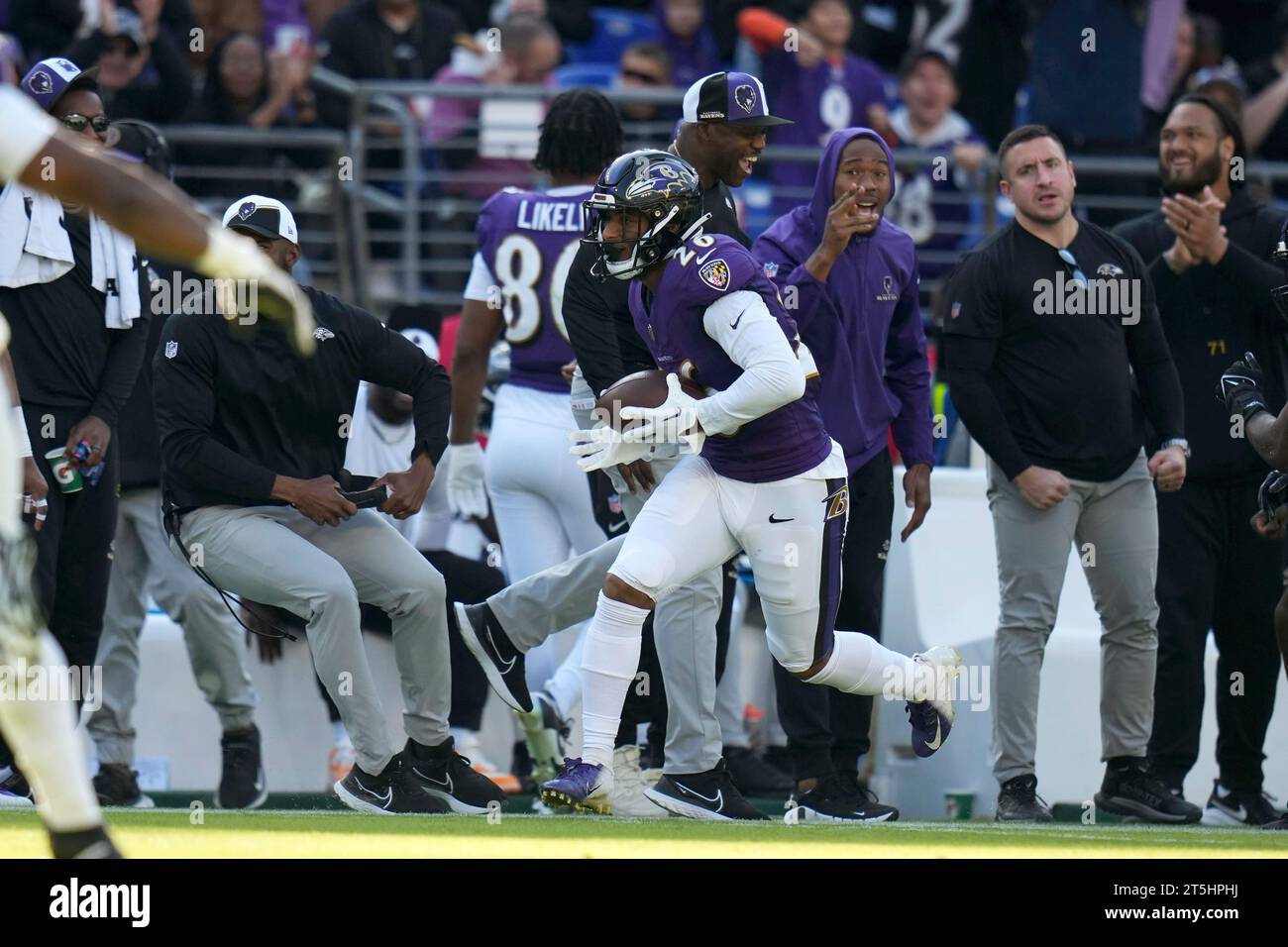 Baltimore Ravens safety Geno Stone (26) celebrates after intercepting a ...