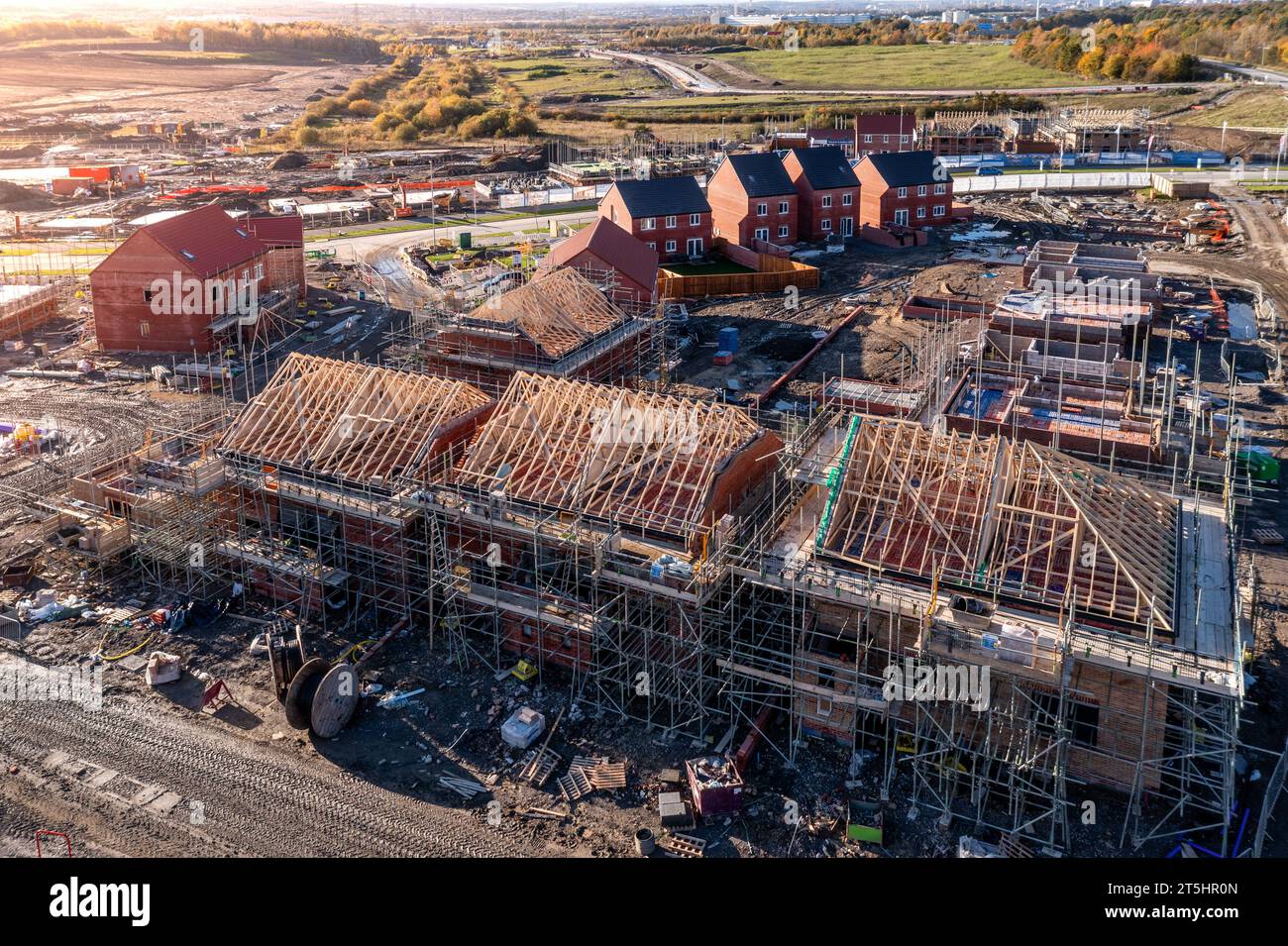 Aerial view of a construction site with new build, energy efficient ...
