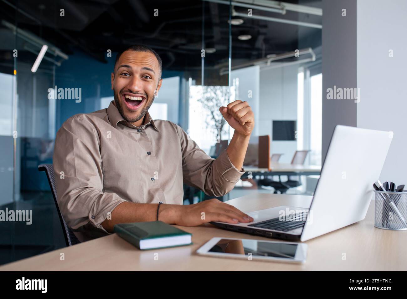 Successful Indian programmer celebrating successful completion of ...