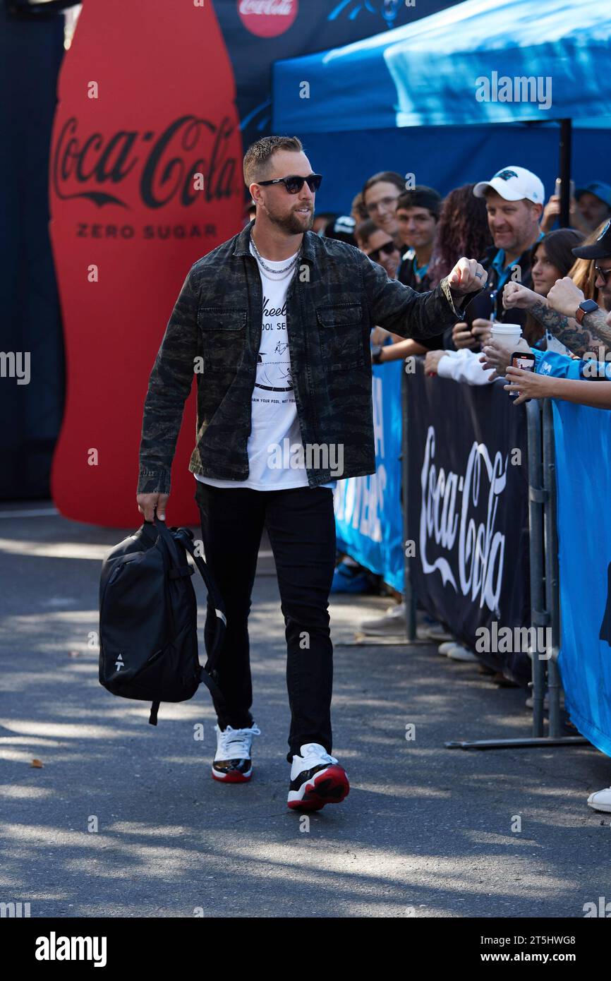 Carolina Panthers wide receiver Adam Thielen (19) bumps fists with fans ...
