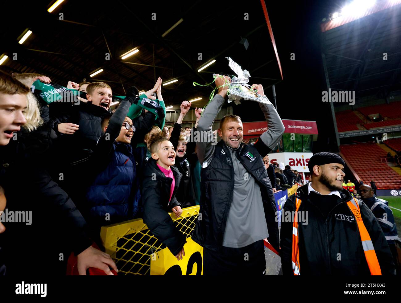 Cray Valley manager Steve McKimm celebrates with a replica of the ...