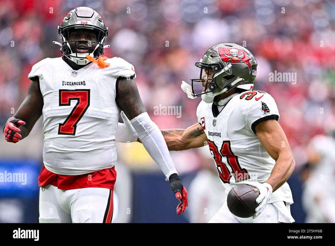 Tampa Bay Buccaneers linebacker Shaquil Barrett (7) and safety Antoine Winfield Jr. (31) react ...