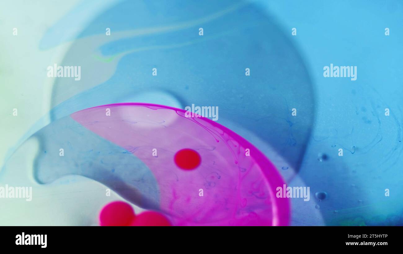 Paint bubble ink water blue pink sphere floating Stock Photo - Alamy