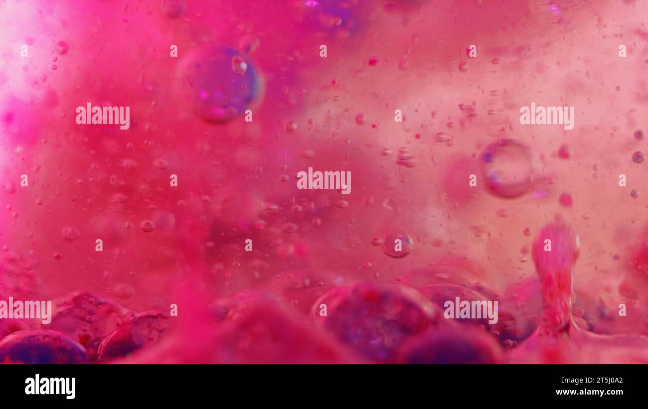 Gel fluid splash paint bubble pink blue droplet Stock Photo - Alamy