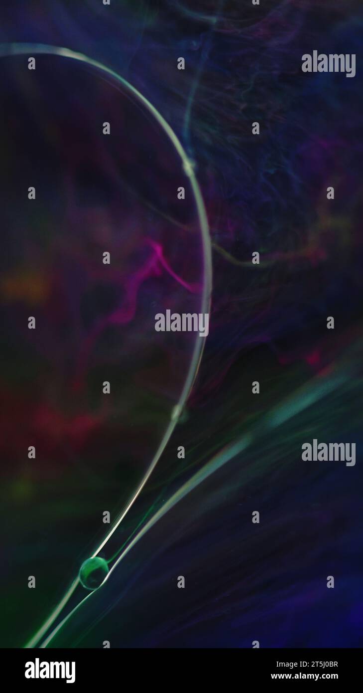 Neon mist paint water bubble oil ink drop mix dark Stock Photo - Alamy