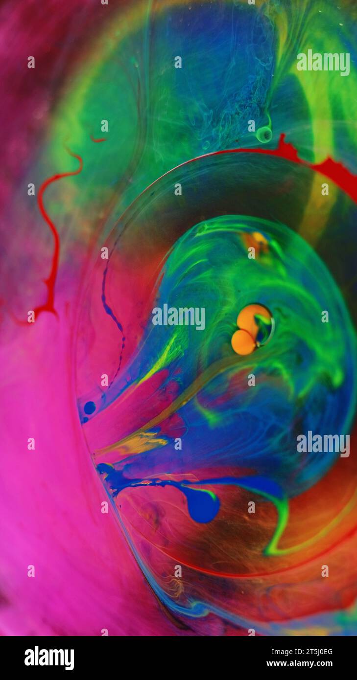 Color ink water oil bubble neon pink green mist Stock Photo - Alamy