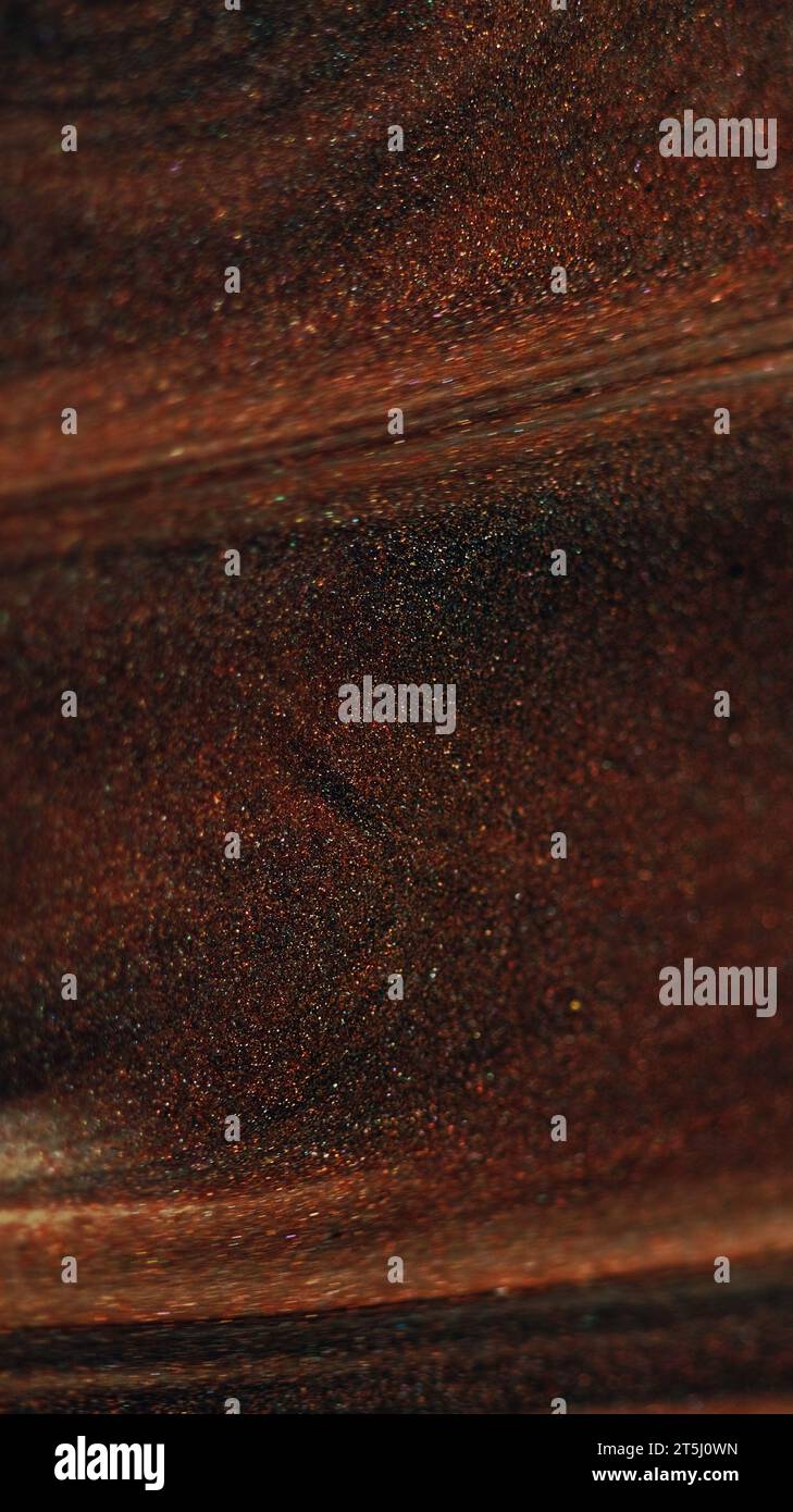 Wet glitter drip paint flow brown metallic fluid Stock Photo - Alamy