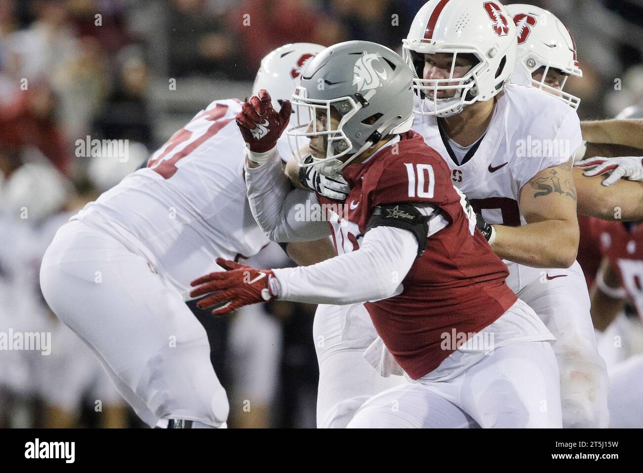 Washington State defensive end Ron Stone Jr. (10) follows a play while ...