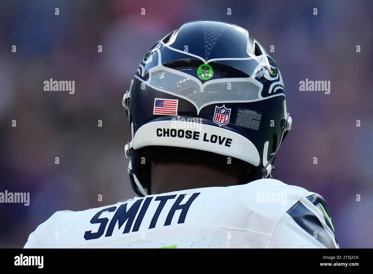 Choose love is seen on the back of Seattle Seahawks quarterback Geno ...