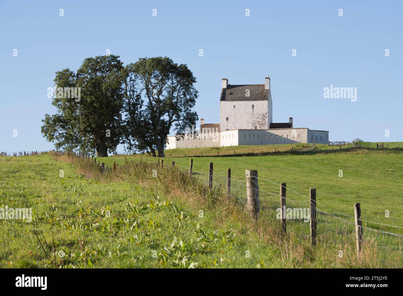 Fencing Leading to a Stand of Trees and Corgarff Castle on a Hillside ...