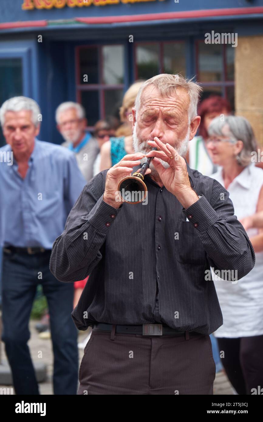 Fife player on the street during local fiesta in Brittany, France Stock ...