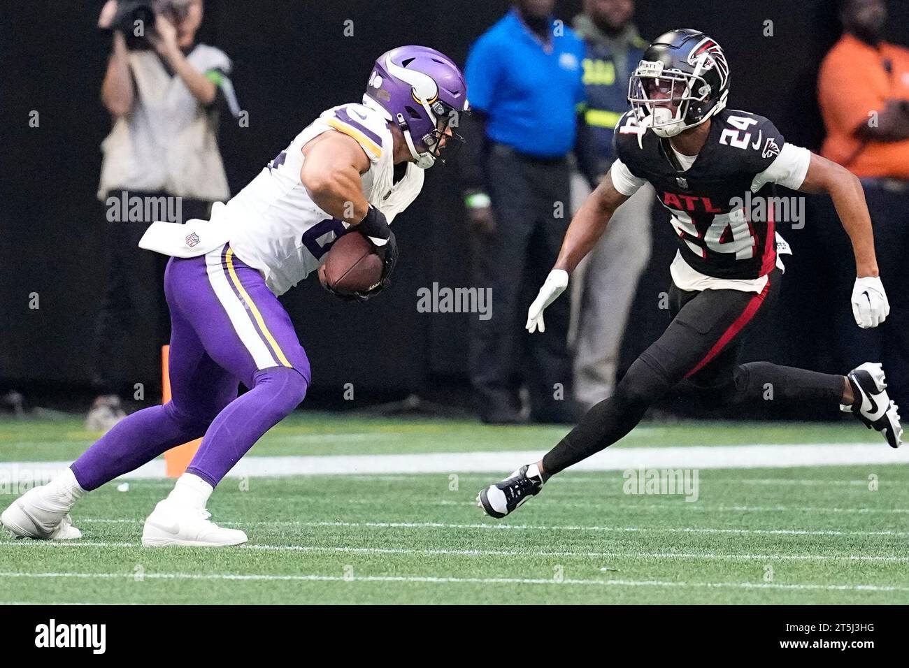 Minnesota Vikings tight end Josh Oliver, left, makes a catch past ...