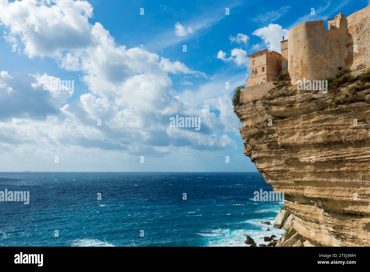 Ancient building in the city of Bonifacio at the edge of the cliff ...
