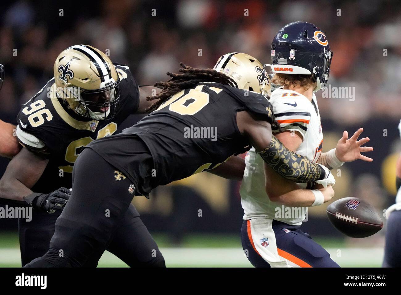Chicago Bears quarterback Tyson Bagent, right, fumbles as he is sacked by New Orleans Saints ...
