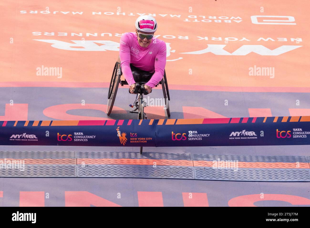 Catherine Debrunner of Switzerland crossing finish line as a winner of ...