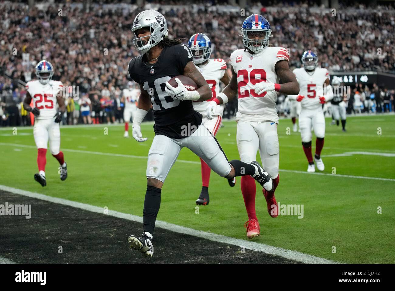 Las Vegas Raiders wide receiver Jakobi Meyers (16) runs in a touchdown after the catch during ...