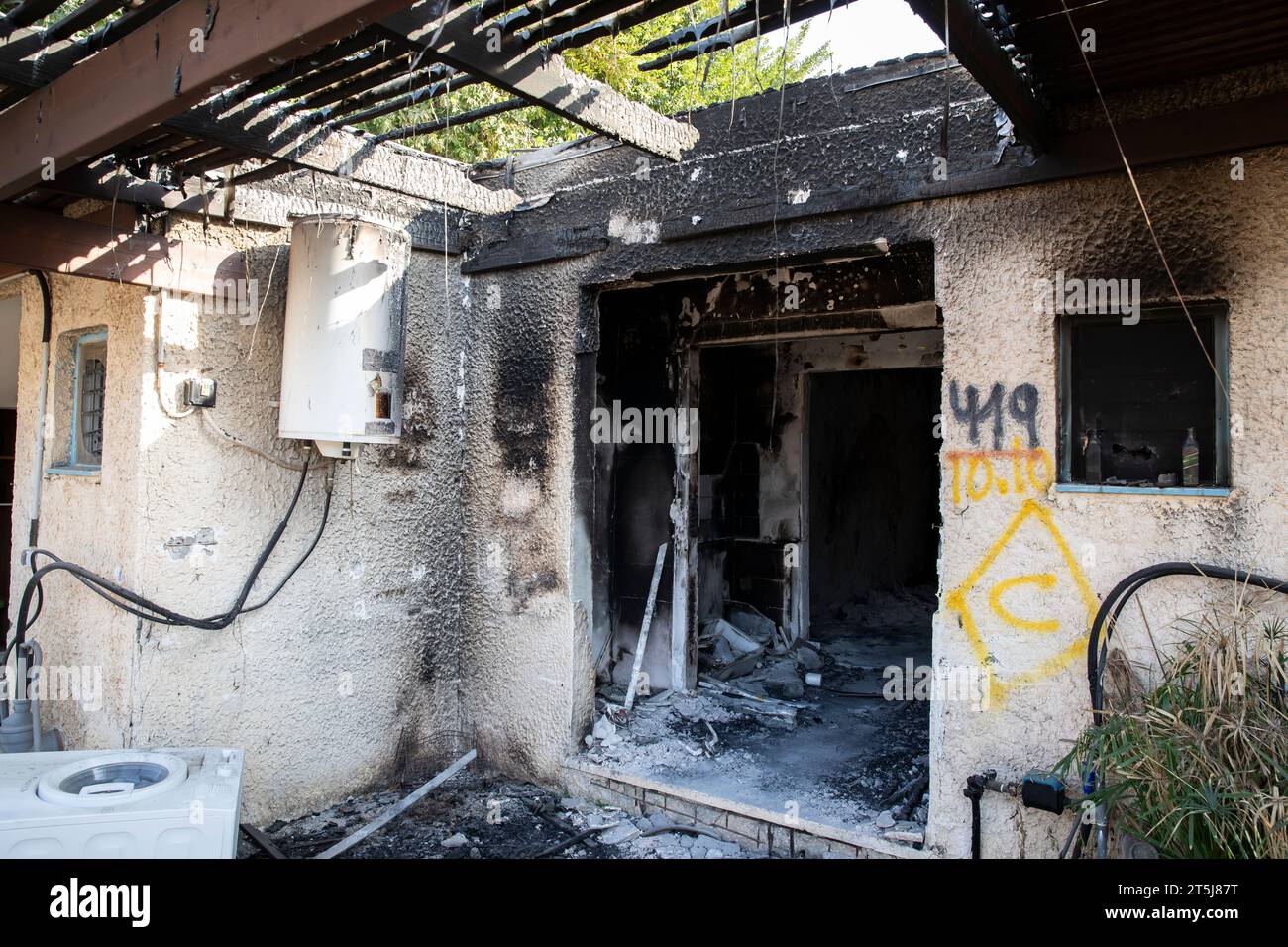 Charred and destroyed buildings of Kibbutz Kfar Aza after a brutal ...
