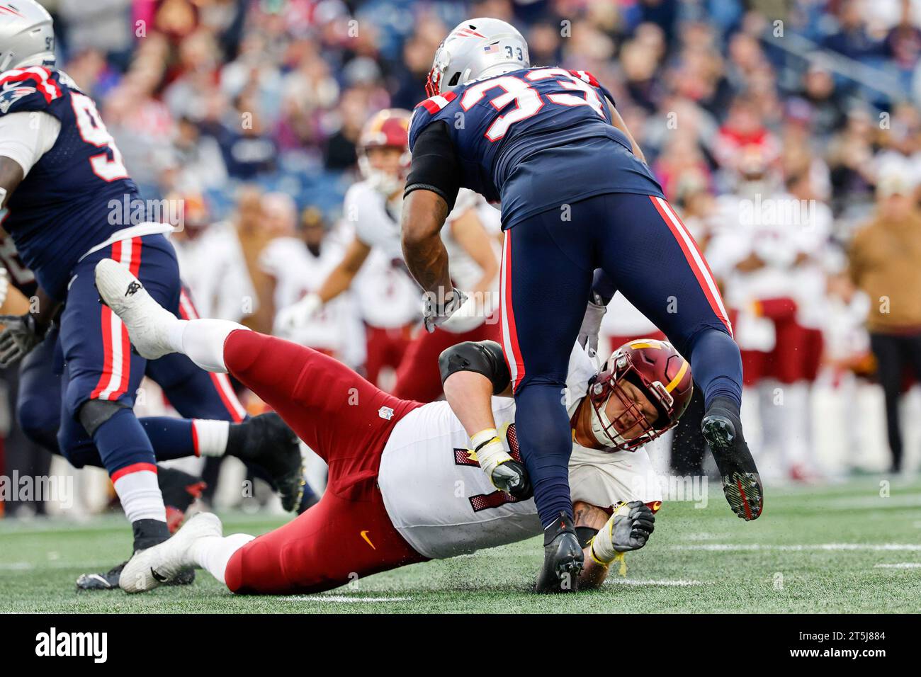 Washington Commanders guard Andrew Wylie (71) battles with New England ...