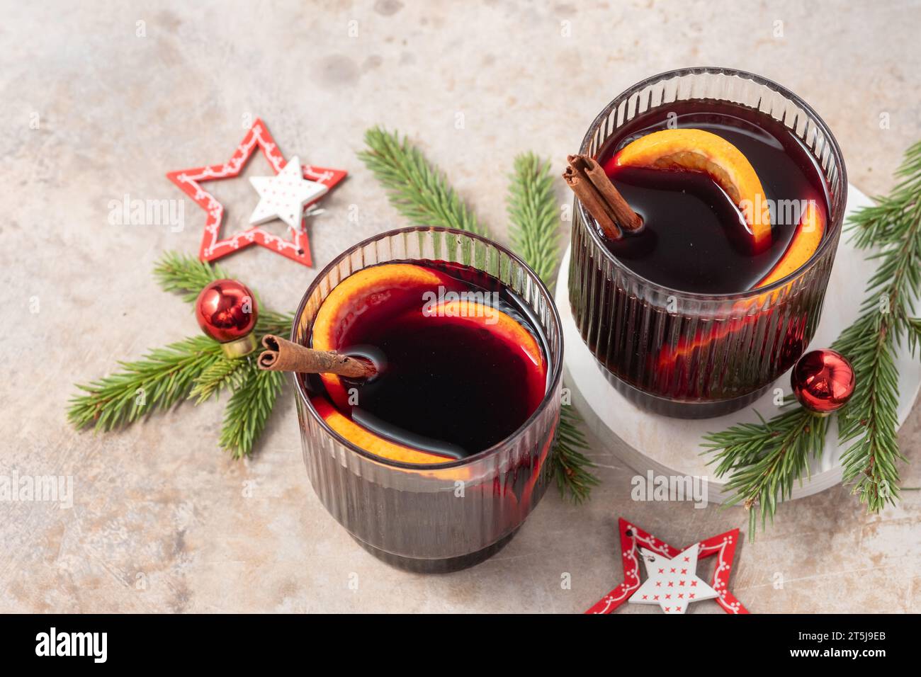 Spiced citrus mulled wine on white linen surface Stock Photo - Alamy