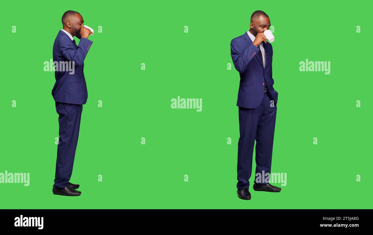 Company employee drinking coffee cup in studio, serving caffeine ...