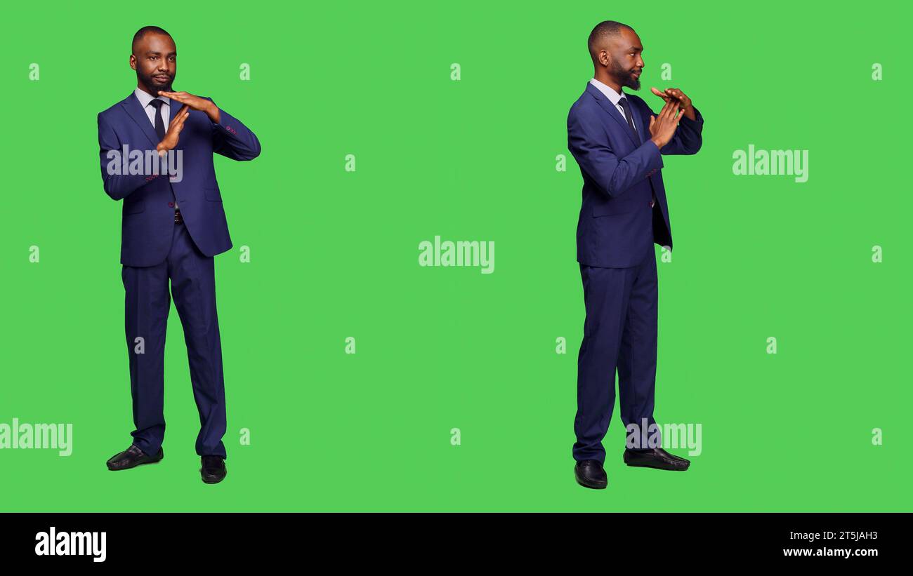 Company worker showing timeout pause gesture on camera posing over full ...