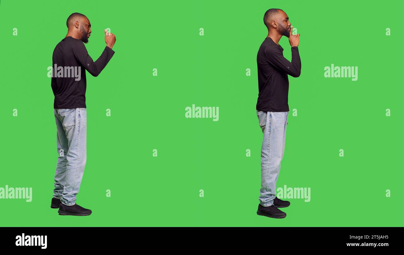 Confident man doing silence mute sign and calling over someone to join ...