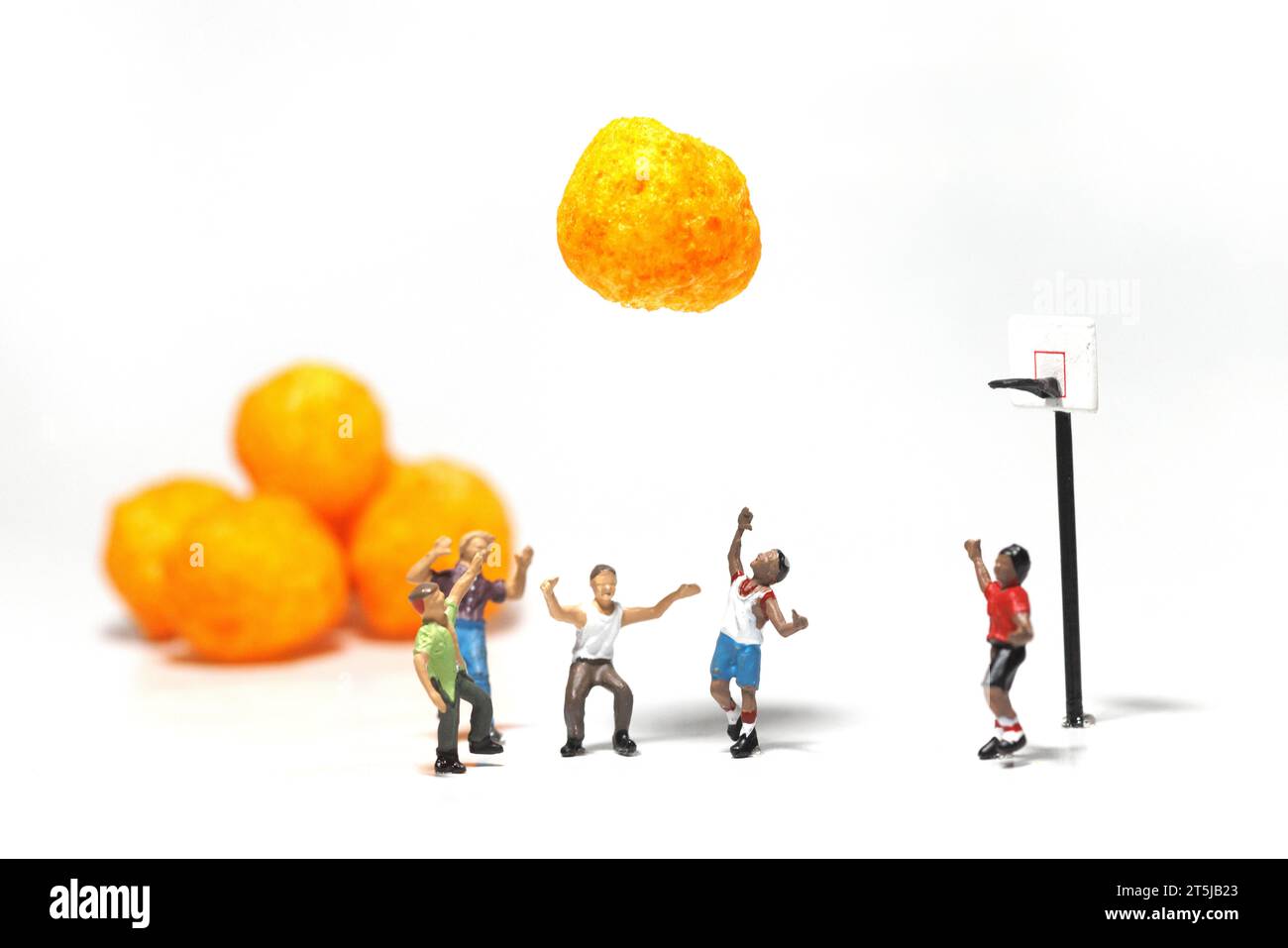 Funny Miniature Scale People Playing Basketball WIth Cheese Snacks ...