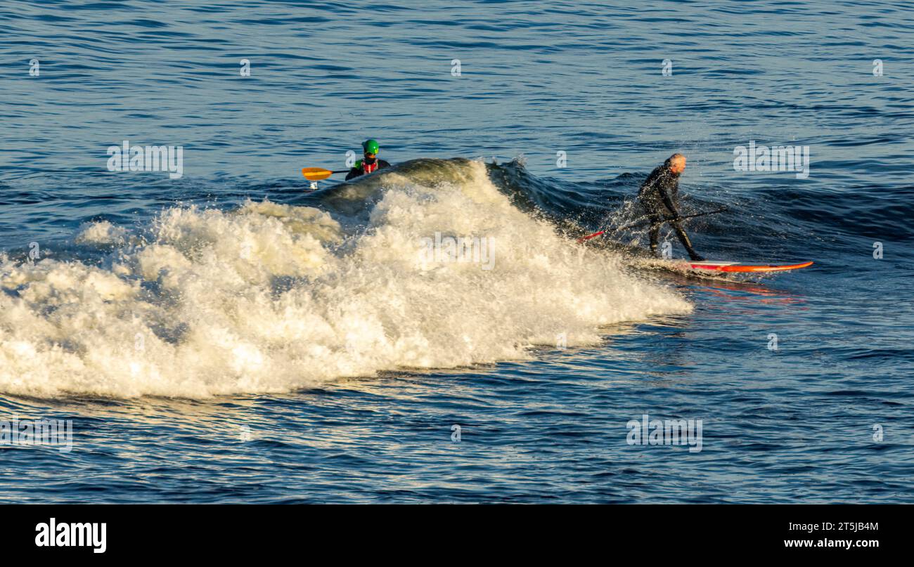 Surfers enjoying big waves in hi-res stock photography and images - Alamy
