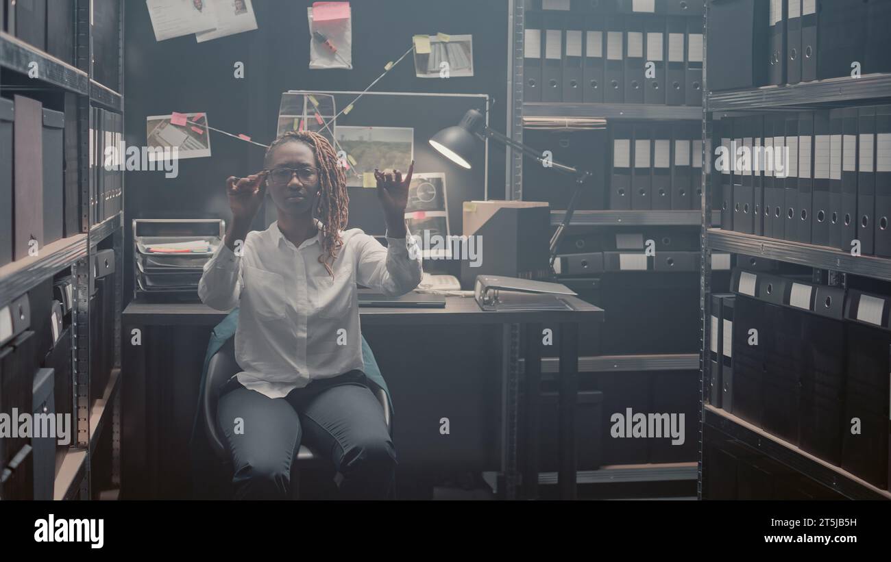 Professional officer analyzing clues on hologram, working with ...