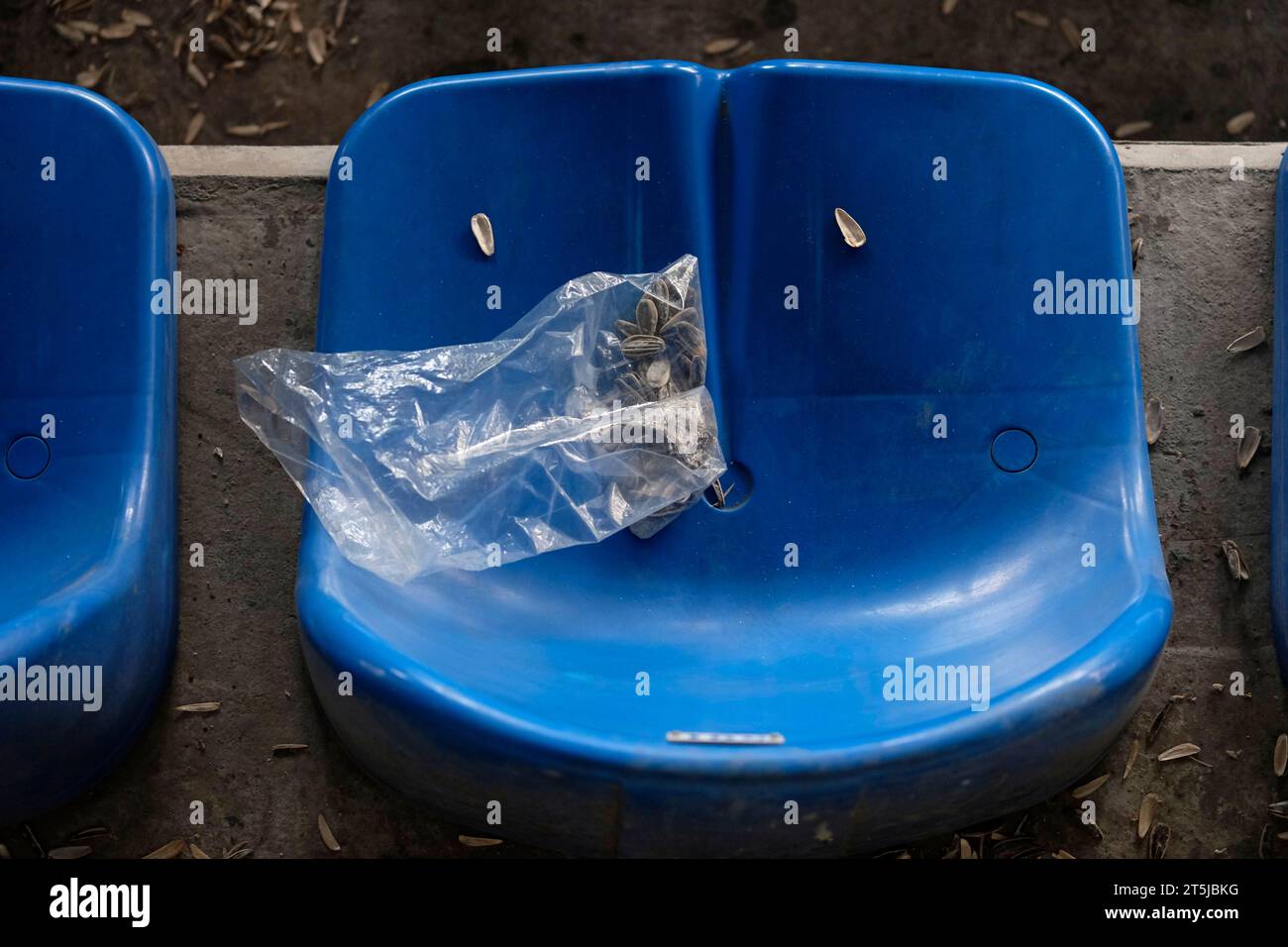 Seat in a football stadium in the Balkans with discarded sunflower ...