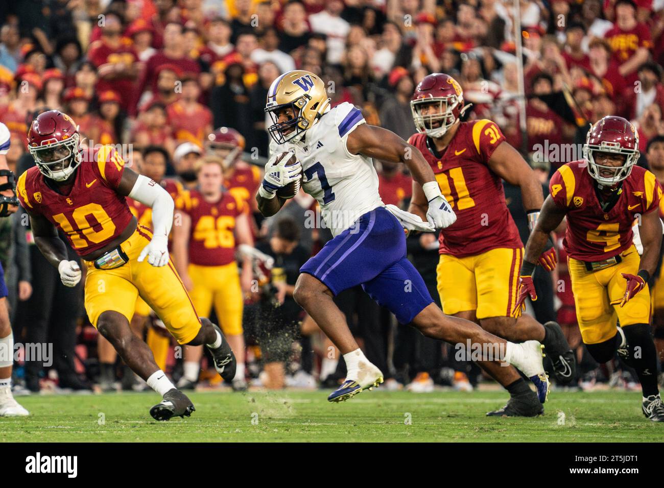 Washington Huskies running back Dillon Johnson (7) runs the ball during ...