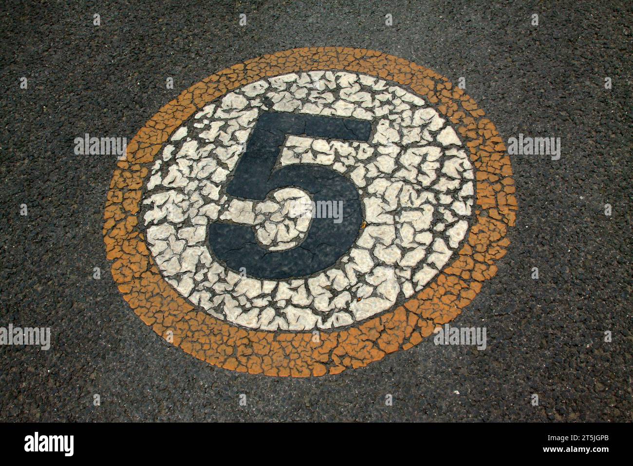 Numbers signs on the asphalt road, closeup of photo Stock Photo - Alamy