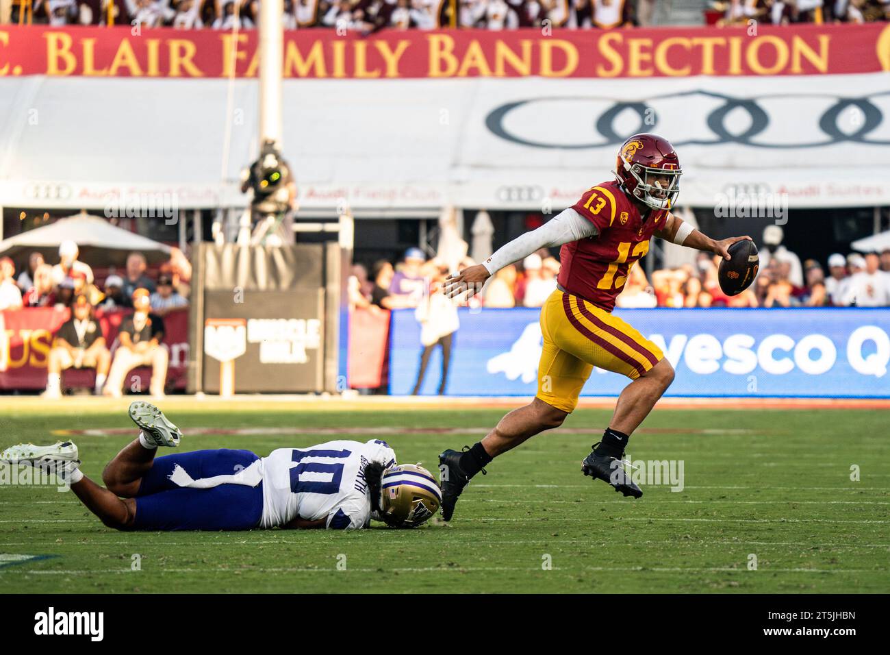 USC Trojans quarterback Caleb Williams (13) escapes from Washington ...