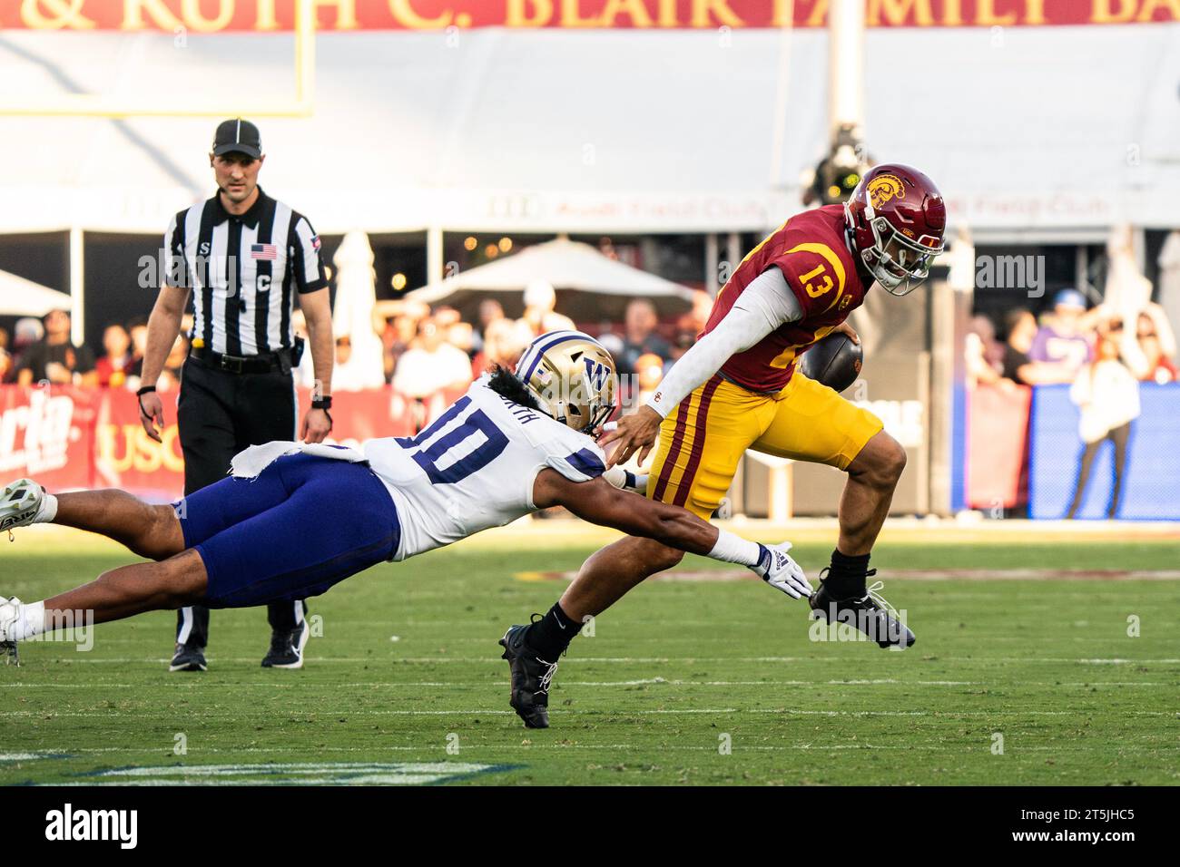 USC Trojans quarterback Caleb Williams (13) escapes from Washington ...