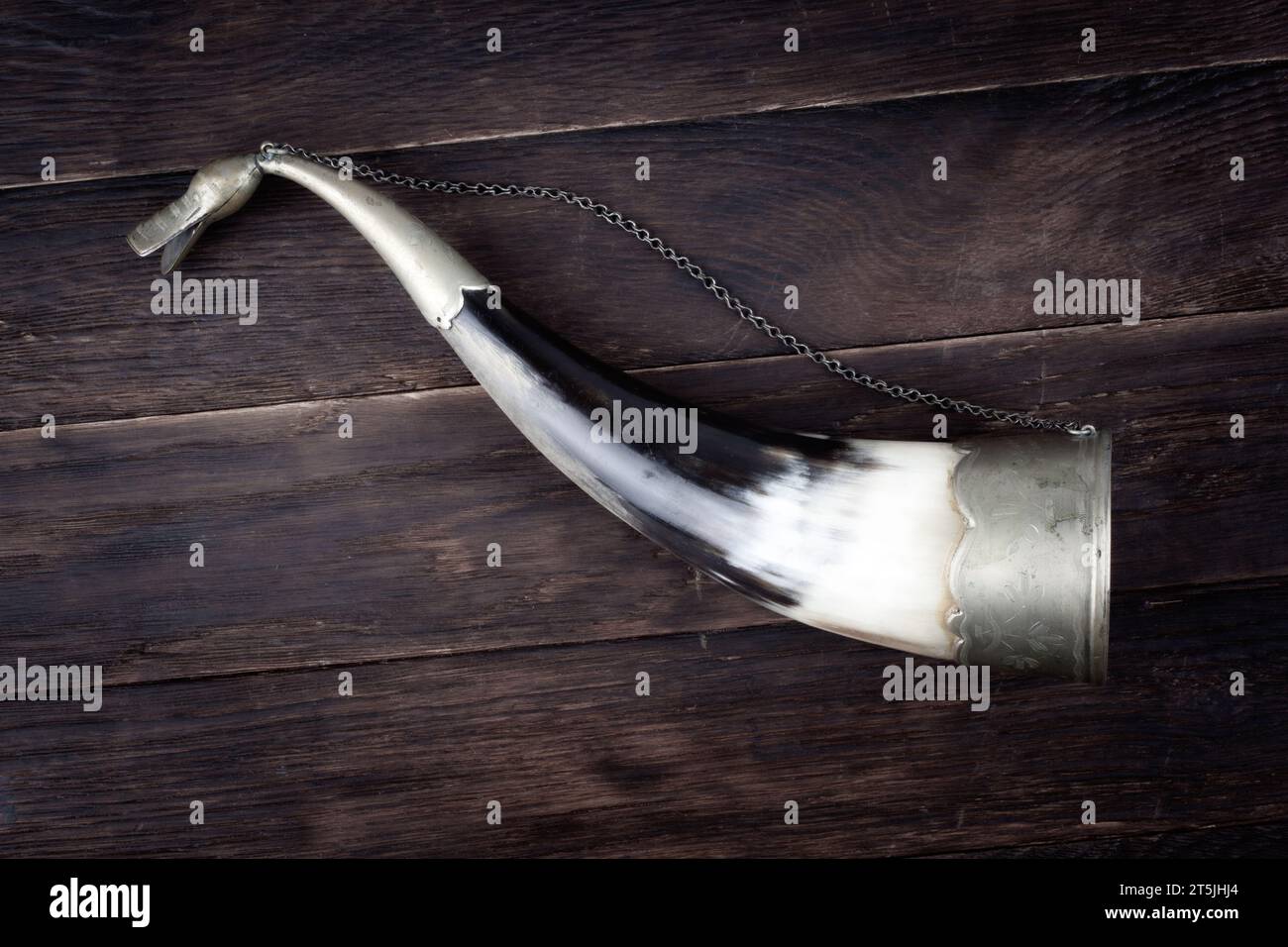 traditional horn for liquor on wooden background Stock Photo - Alamy