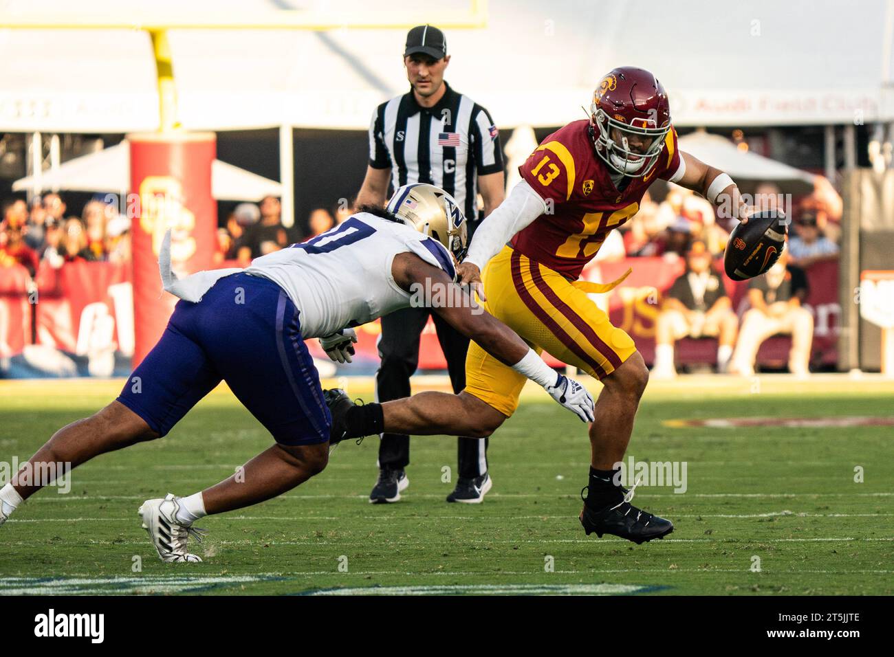 USC Trojans quarterback Caleb Williams (13) escapes from Washington ...