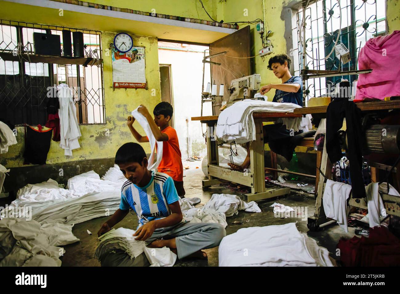 Child garment labour hi-res stock photography and images - Alamy