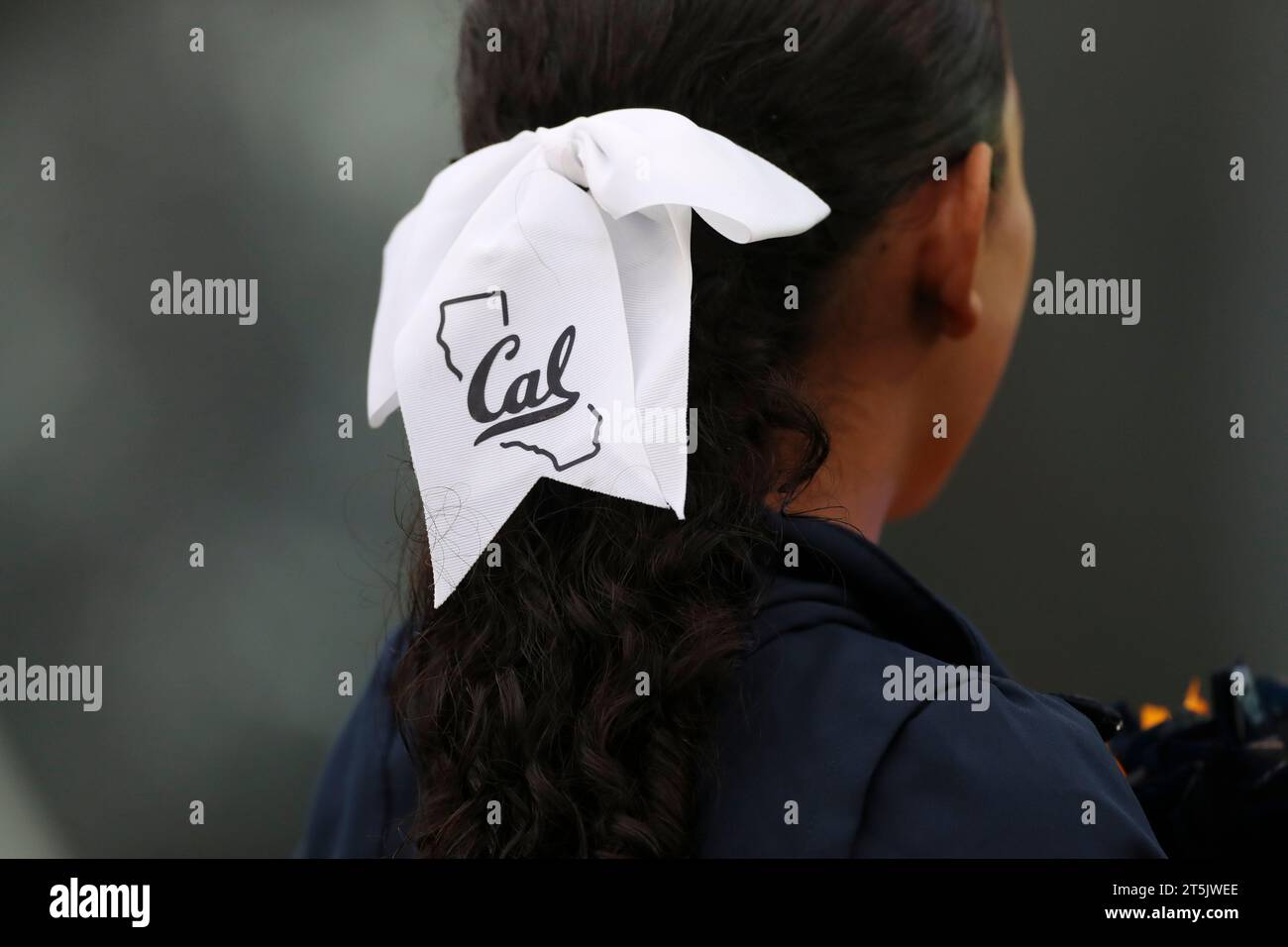 A California cheerleader wears a ribbon in her hair during the first ...