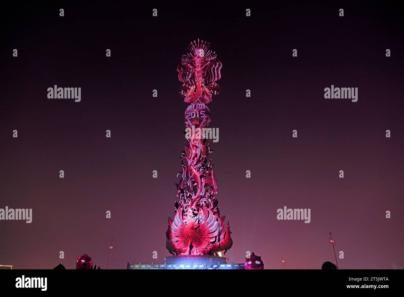 Phoenix sculpture in the night sky, Tangshan City, China Stock Photo ...