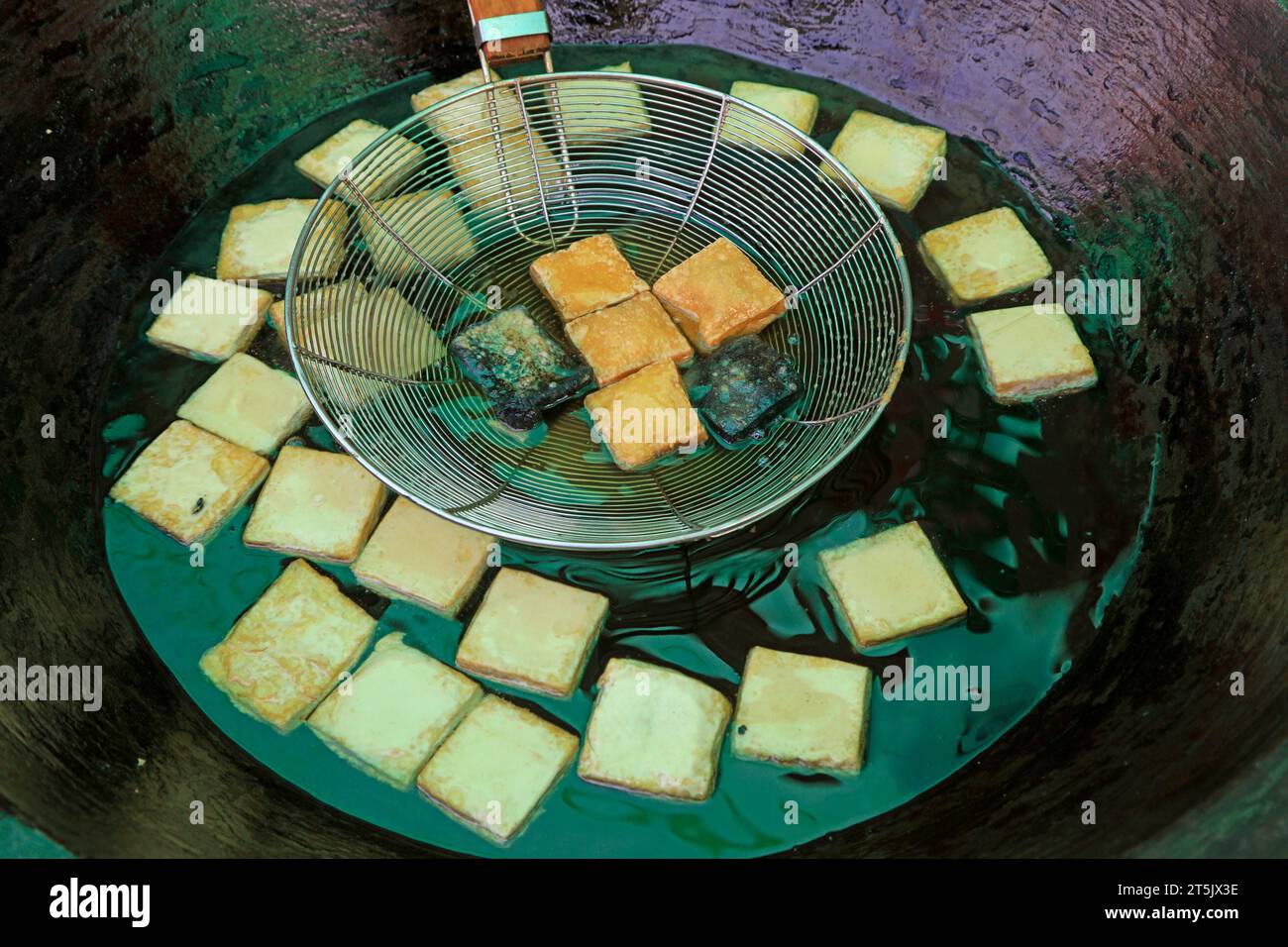 Chinese cooking of fried stinky tofu Stock Photo - Alamy